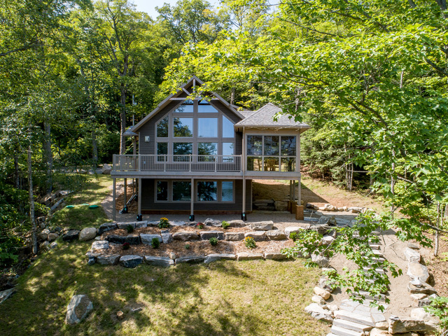 Striking new build nestled on the shores of Ril Lake ~ Rick Wearing ...